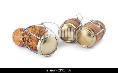 Corks of sparkling wine and muselet caps on white background Stock ...