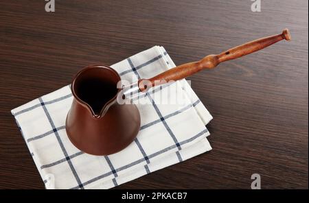 Clay cezve for making coffee. Coffee turk on the table Stock Photo - Alamy