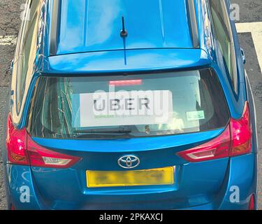uber sign in back of estate car Stock Photo - Alamy