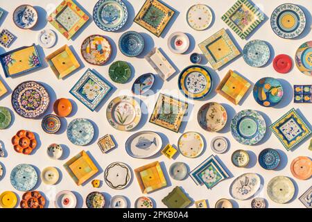 Collection of colorful Portuguese ceramic pottery, local craft products ...