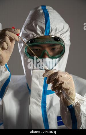 Medical personnel performing an antigen test for covid-19 Stock Photo ...