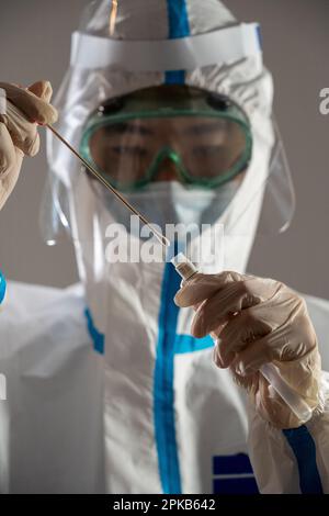 Medical personnel performing an antigen test for covid-19 Stock Photo ...
