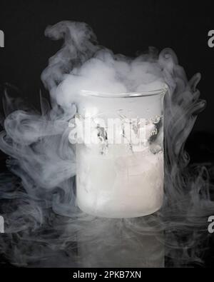 Dry ice sublimating in a glass beaker Stock Photo - Alamy