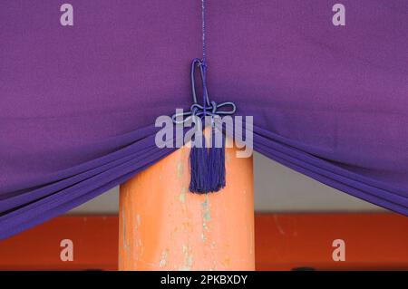 Details of a wooden column and the temples that decorate it, at ...