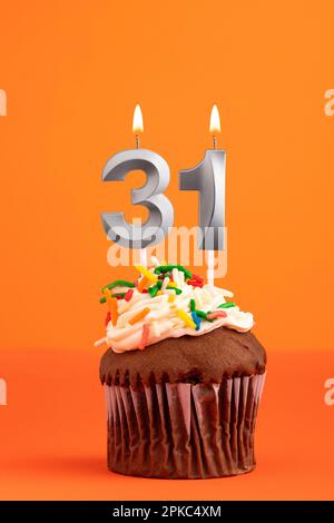 Birthday cake with candle number 31 - Rhodamine Red foamy background ...