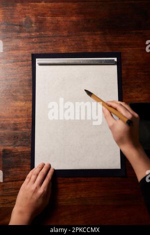 Woman's hand doing calligraphy at desk Stock Photo - Alamy