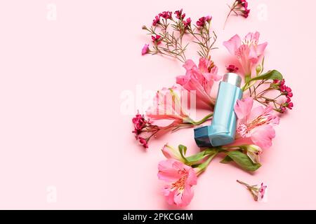 Asthma inhaler with flowers on pink background Stock Photo - Alamy