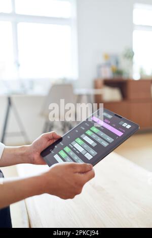 Hand placing a stock order with a tablet at his desk Stock Photo - Alamy