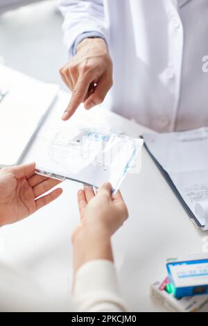 Man in white handing medicine and woman receiving medicine Stock Photo ...