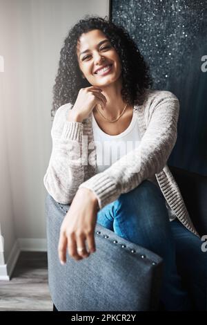 Taking a well-deserved break. A beautiful young woman sitting at the ...