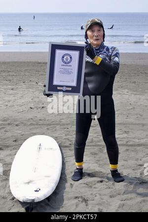 Seiichi Sano, an 89-year-old Japanese man, tries to ride a wave at ...