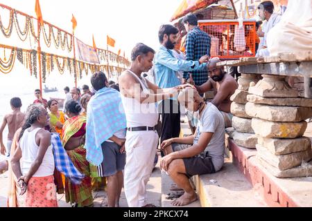 Varanasi, India - Nov 2022: street barber shaving head of male devotees ...