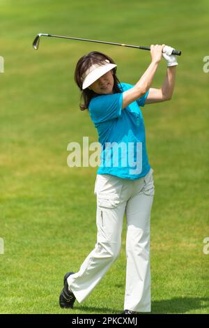 Middle-aged and older women playing golf Stock Photo - Alamy