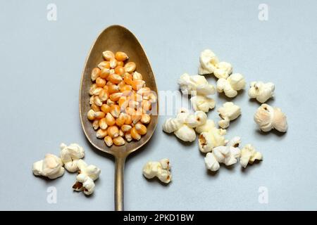 Corn (Zea mays) kernels in ladle and popcorn, puffed corn Stock Photo ...