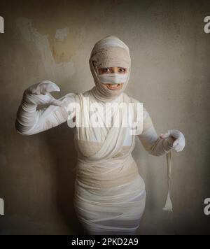 woman wrapped in bandages as egyptian mummy halloween costume Stock ...