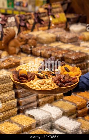 Mixed nuts platter. Wood nut plate prepared with hazelnuts, cashews ...