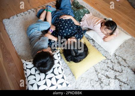 Children taking a nap in the living room Stock Photo - Alamy