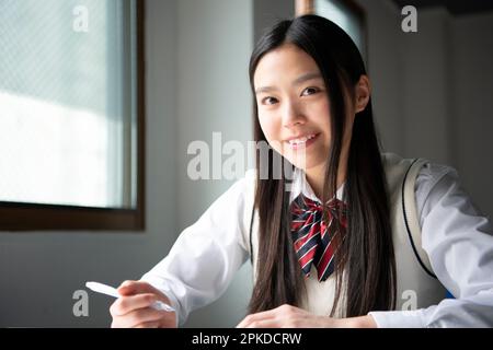 High school girl laughing with a sharp pencil Stock Photo - Alamy