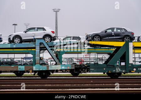 Freight train, car carrier brings new cars from Germany, for export by ...