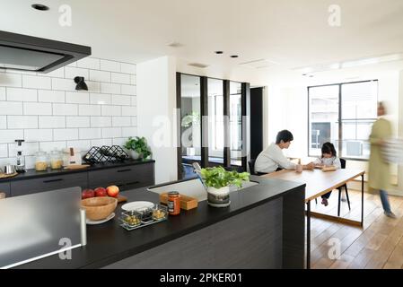 Parents and children doing housework and painting Stock Photo - Alamy