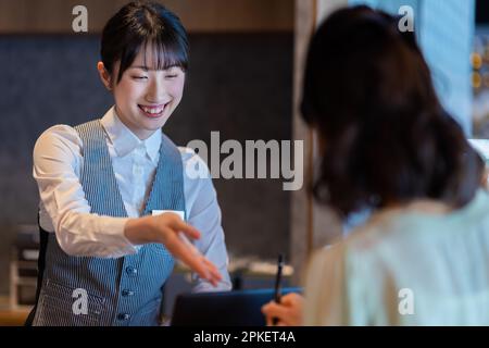 Hotel check-in counters Stock Photo - Alamy