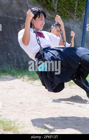 Junior High School Student Rowing a Swing Stock Photo - Alamy