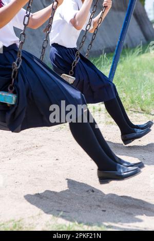 Junior High School Students Paddling on Swings Stock Photo - Alamy