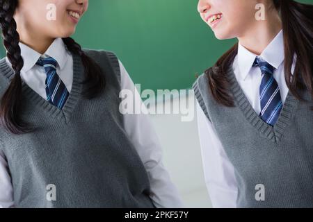 Junior high school girls who get along well with each other Stock Photo ...