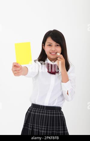 High school student giving a yellow card Stock Photo - Alamy
