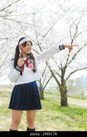 Asian High School Girls student hand touch grass in countryside with ...
