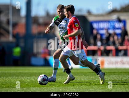 Dan Scarr #6 of Plymouth Argyle wins aerial ball during the Sky Bet ...