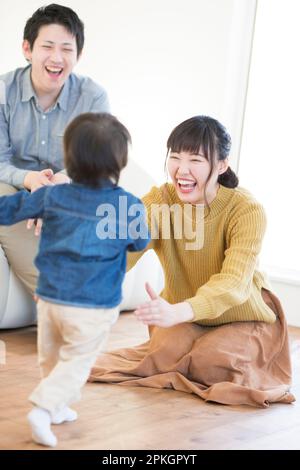 Boy rushing to his parents Stock Photo - Alamy