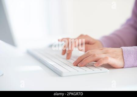 Woman's hand operating computer Stock Photo - Alamy