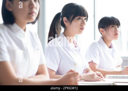 Nursing students taking a class in a classroom Stock Photo - Alamy