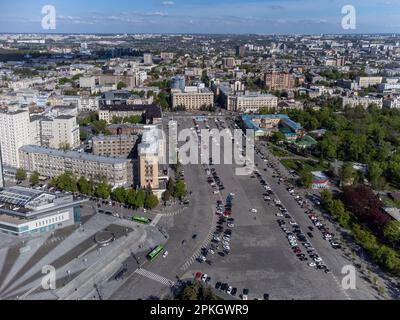 Aerial view on Freedom (Svobody) Square with green spring park and cars ...