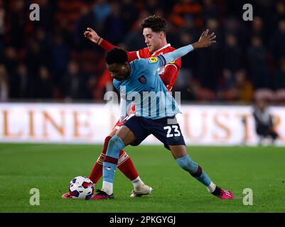 Middlesbrough's Hayden Hackney (left) and Burnley's Hannibal Mejbri ...