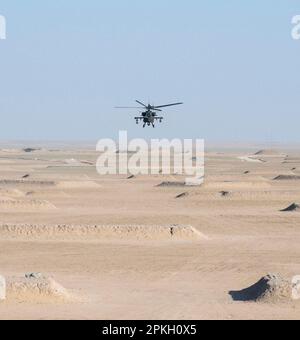 A Kuwait Air Force AH-64 Apache helicopter returns to its battle ...