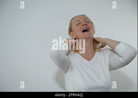 Portrait of beautiful trendy cheery amazed girl using laptop showing ...