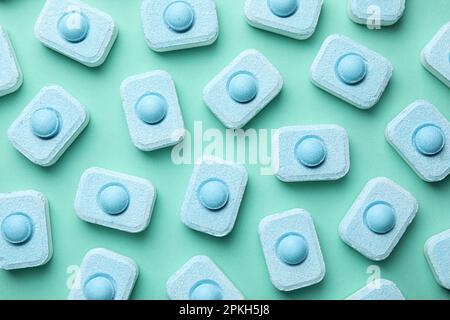 Water softener tablets on turquoise background, flat lay Stock Photo ...