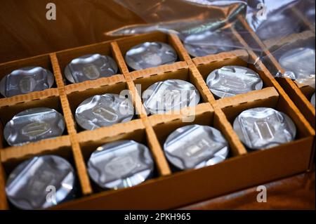 Finished batch of aluminum pistons for car engine in box Stock Photo ...