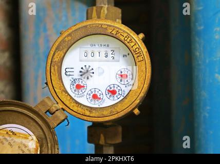 Selective focus of meter and water pipes in open shaft of residential ...