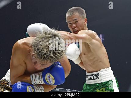 Tenshin Nasukawa (L) punches Yuki Yonaha in a super bantamweight six ...