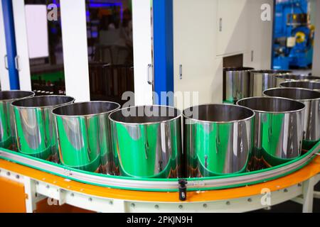 Liquid filling in tin metal containers on conveyor Stock Photo - Alamy