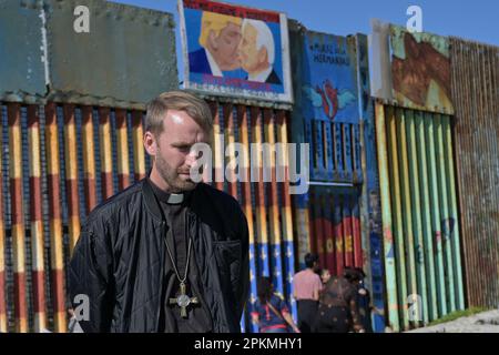 A painted mural depicting Leonid Brezhnev and Erich Honecker kissing at ...