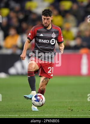 Toronto FC midfielder Jonathan Osorio (21) and defender Kevin Long (5 ...