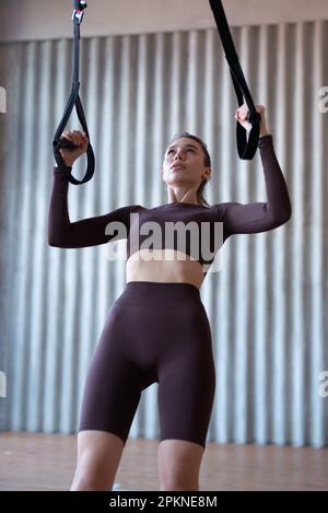 a woman training her pectorals Stock Photo - Alamy