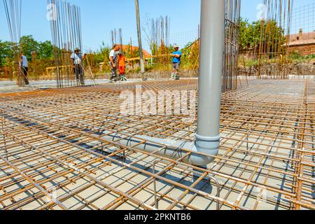 New grey mounted sewerage pipe passing between floors in the ...