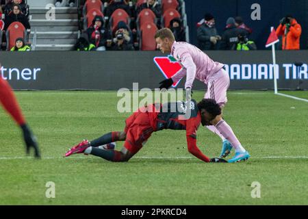 Inter Miami forward Robbie Robinson, left, runs with the ball as ...