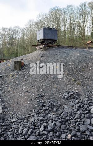 Metal coal truck on rails at coalpit mining industrial area Stock Photo ...