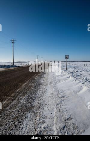 A Canadian prairie landscape with a dirt gravel country road near ...
